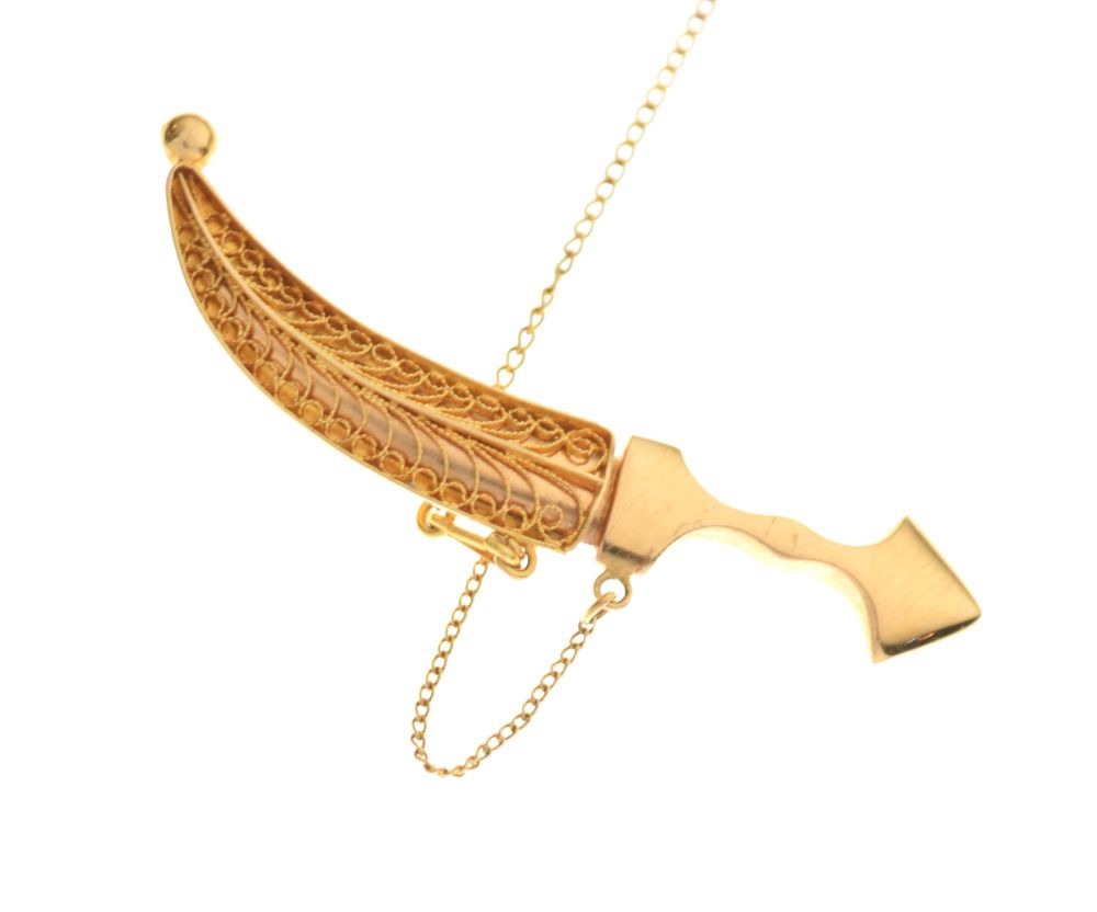 Lot 24 - Unmarked yellow metal Eastern dagger brooch