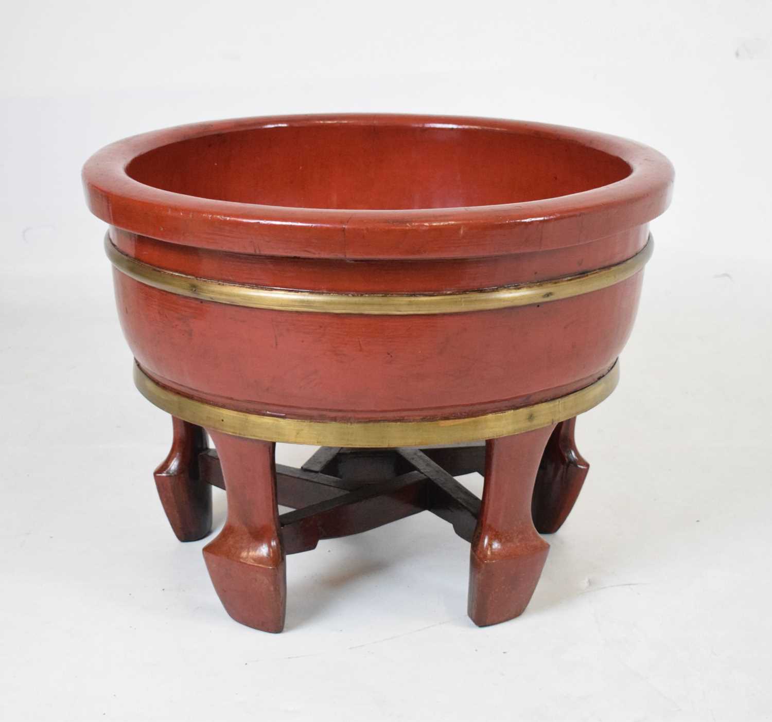 Lot 715 - Chinese red lacquer planter standing on four
