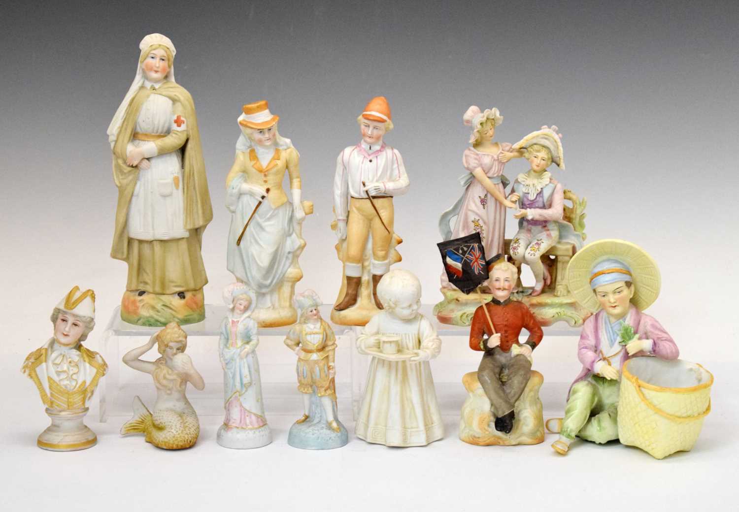 Lot 324 - Group of small bisque porcelain figures