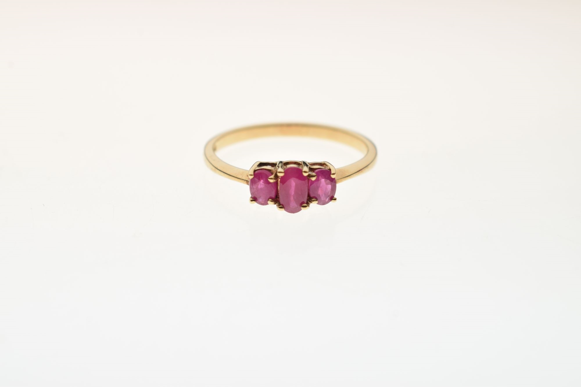 Lot 43 - 9ct gold three-stone ruby ring