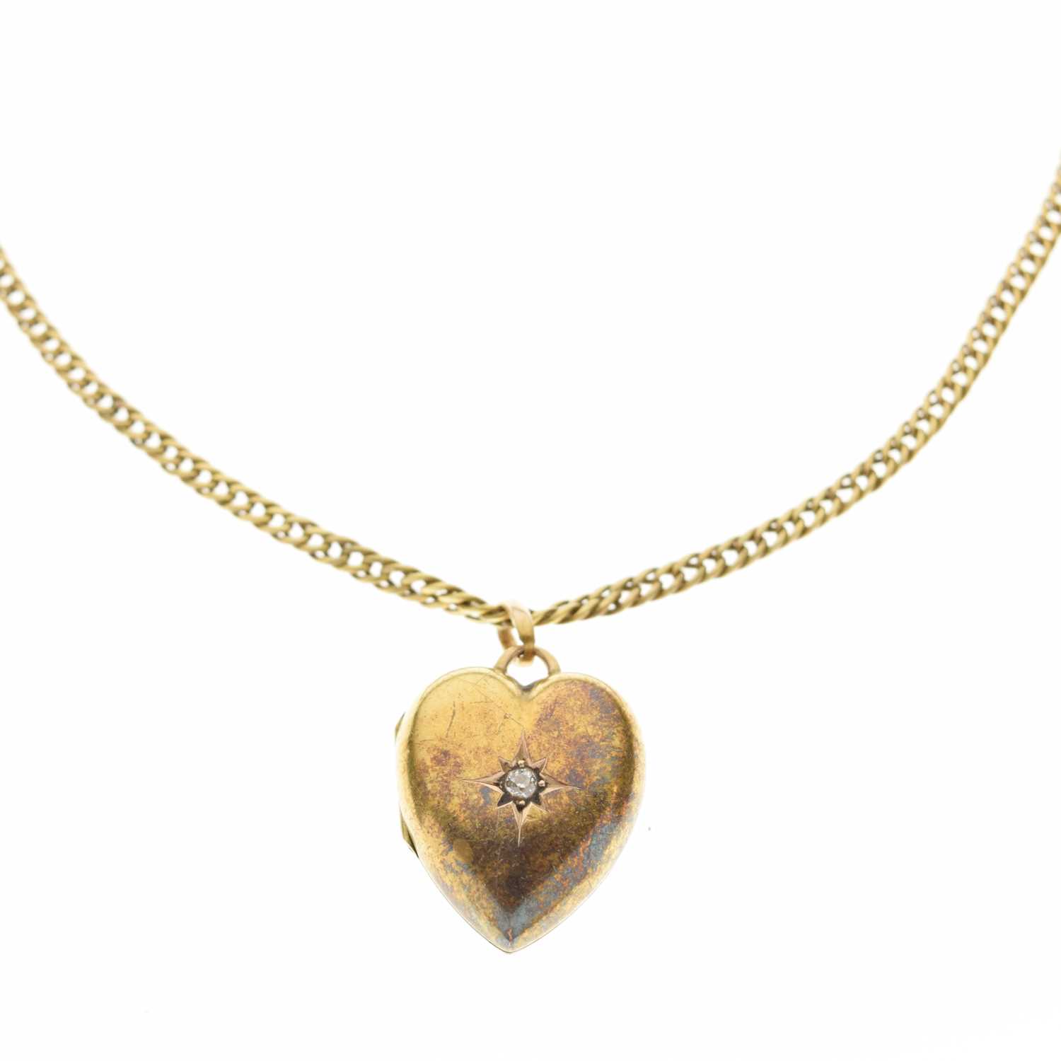 Lot 111 - Yellow metal heart-shaped locket set a