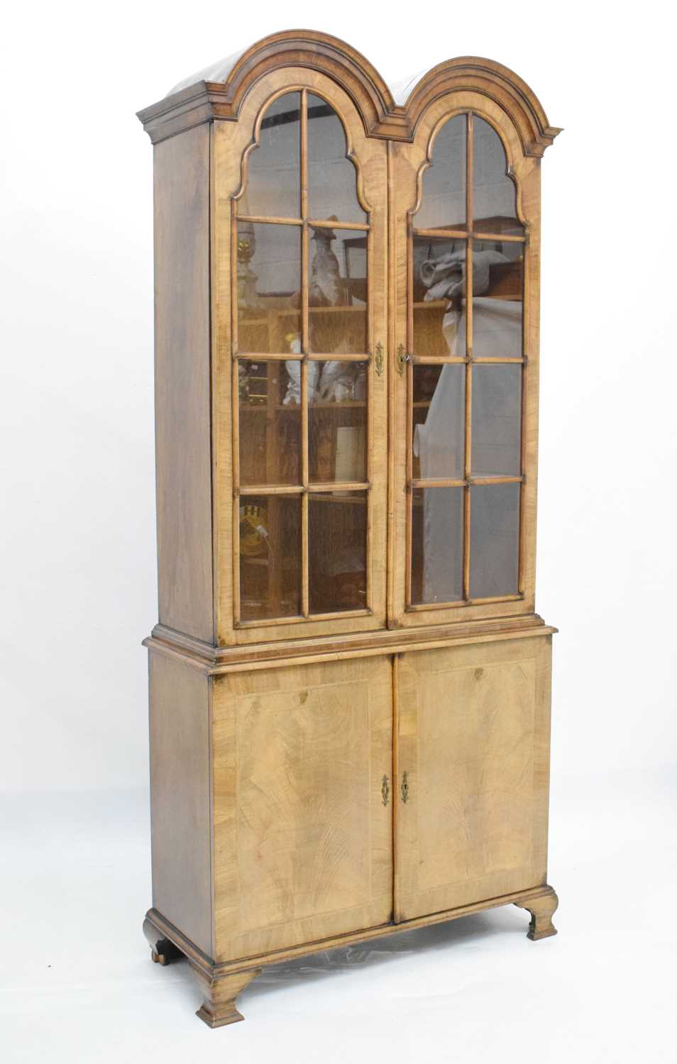 Lot 837 - Reproduction walnut twin domed bookcase in