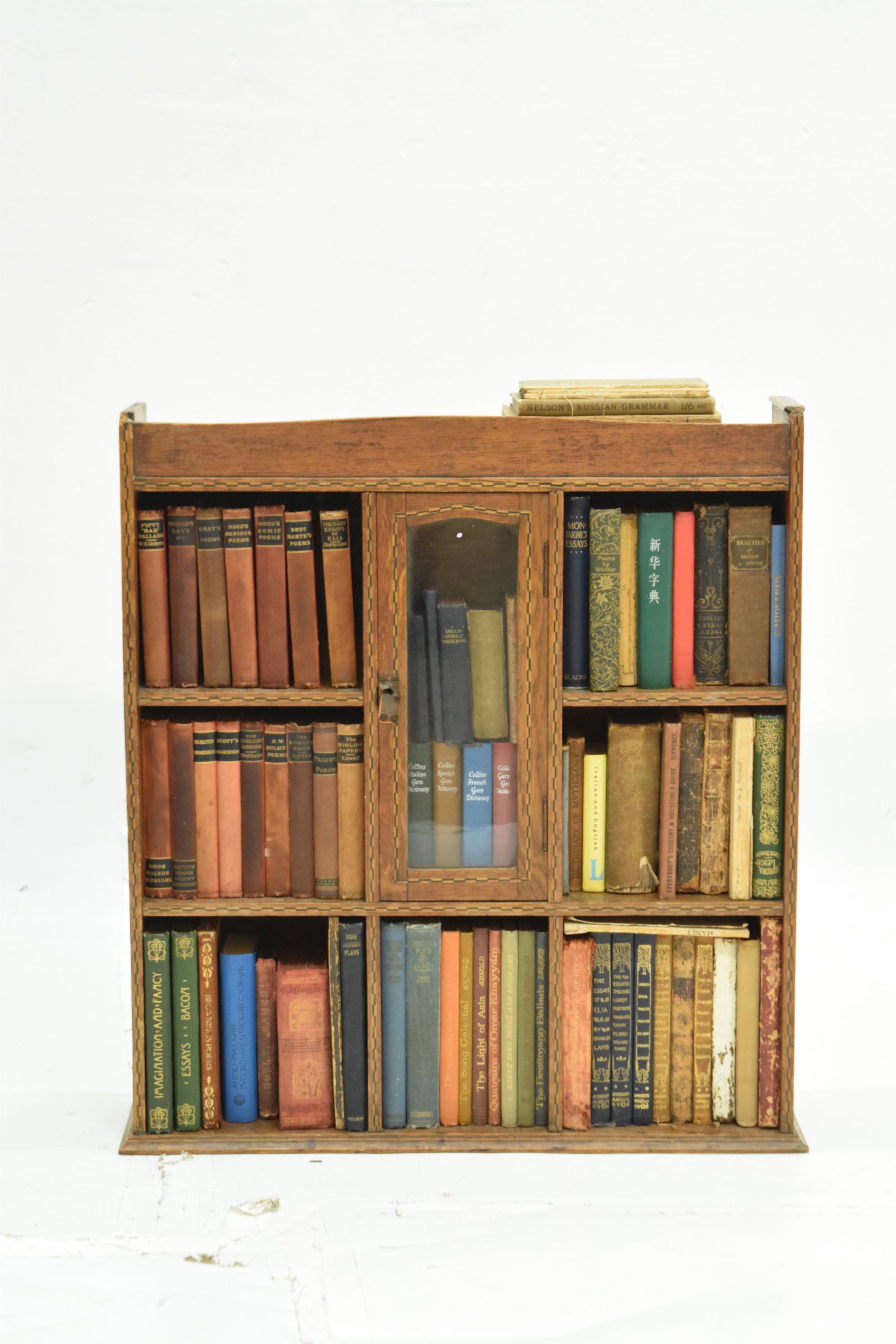 Lot 610 - Early 20th century oak table-top bookcase