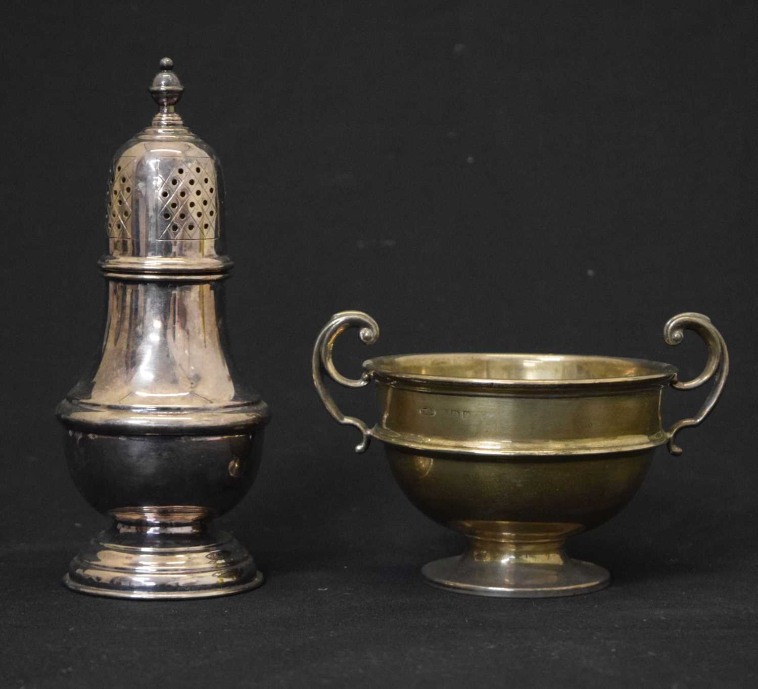 Lot 146 - Elizabeth II silver sugar caster, and a