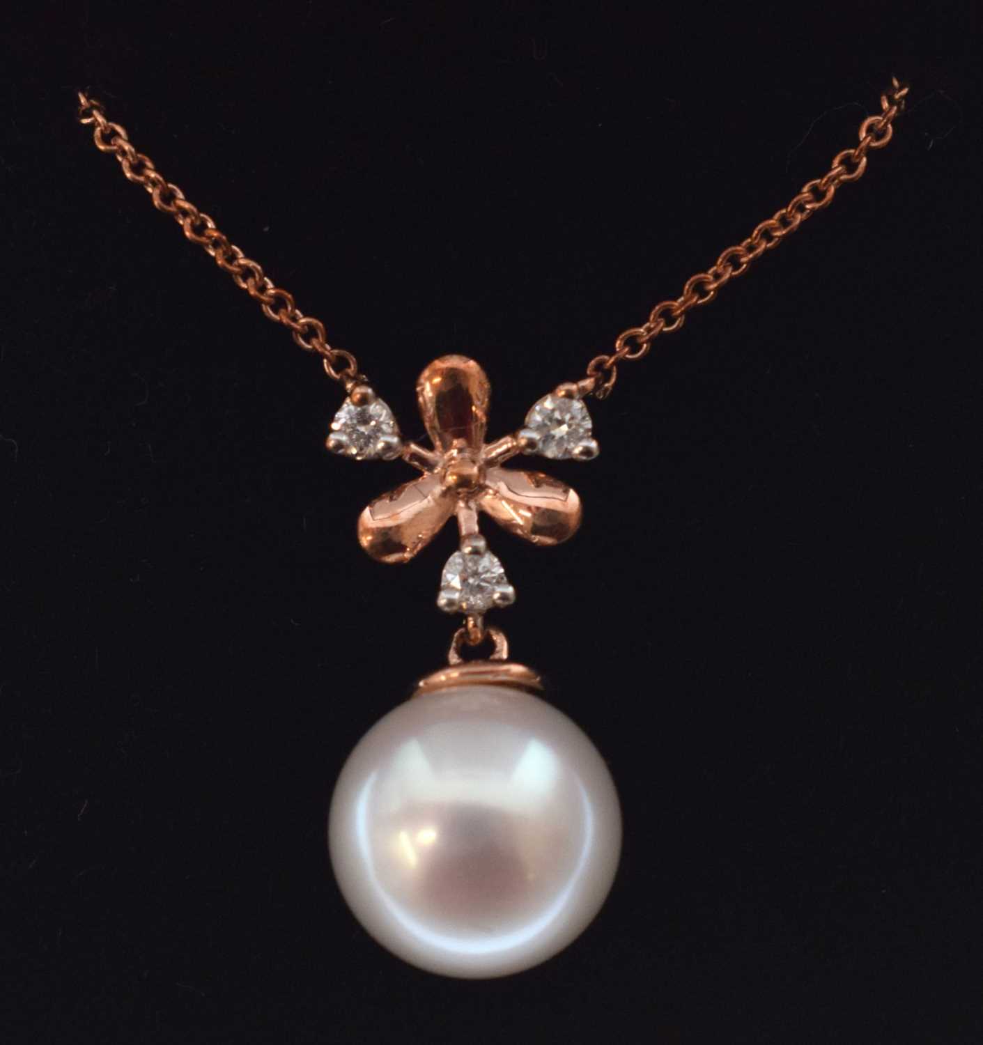 Lot 54 - 9ct rose gold, diamond and pearl 'snowflake'