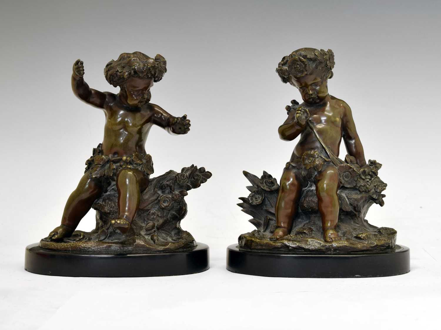 Lot 161 - Pair of bronze figures of putti in the