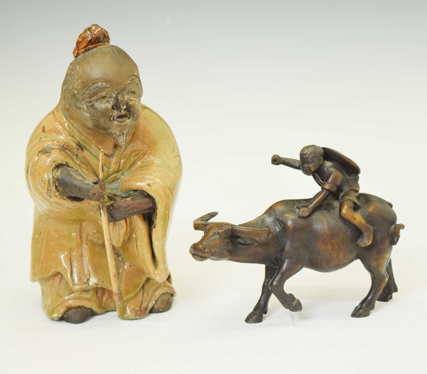 Lot 586 - Japanese pottery figure of a gentleman and a