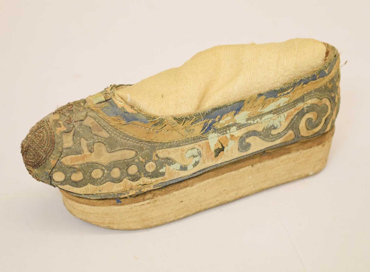 Lot 572 - Antique Chinese lady's embroidered silk shoe