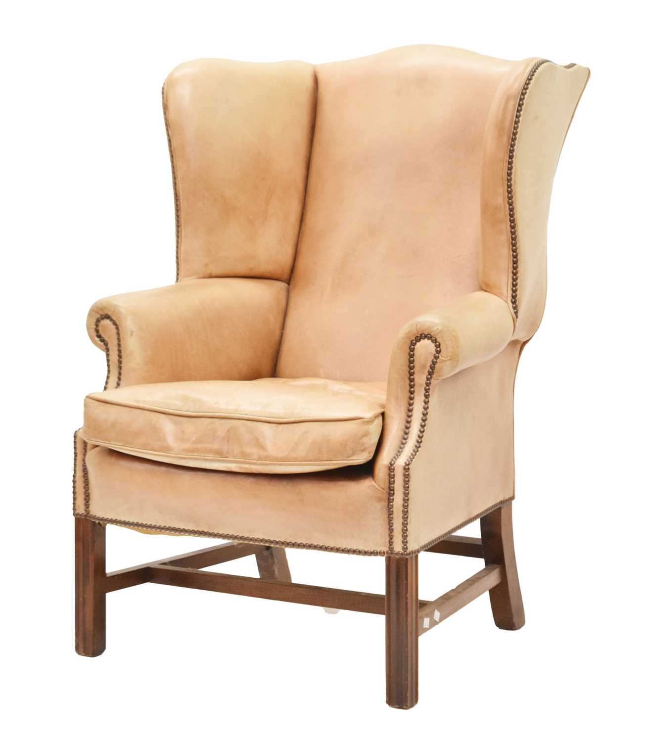 Lot 727 - Studded pale tan leatherette wing-back