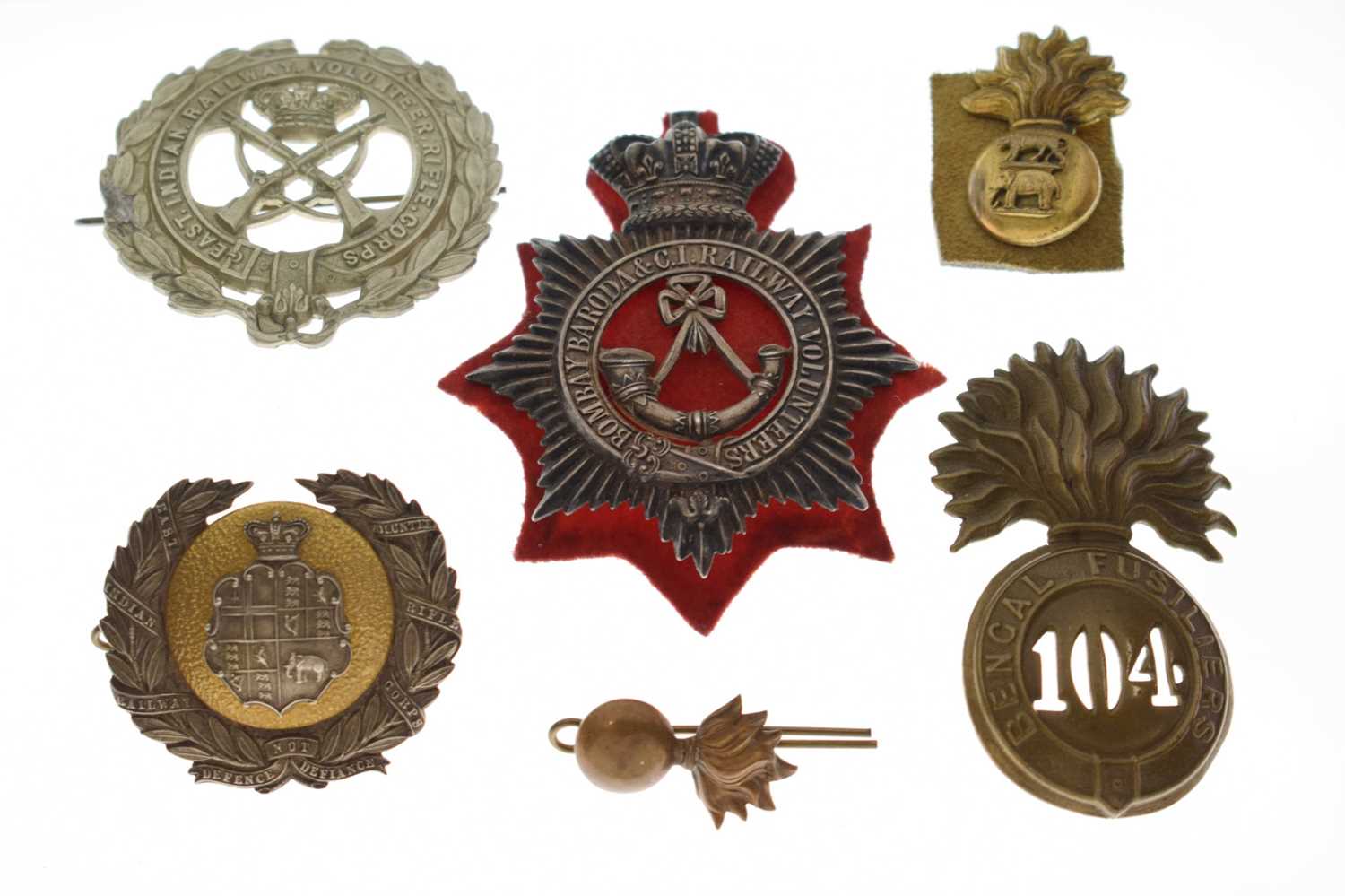 Lot 438 - Four British Raj-associated cap badges and