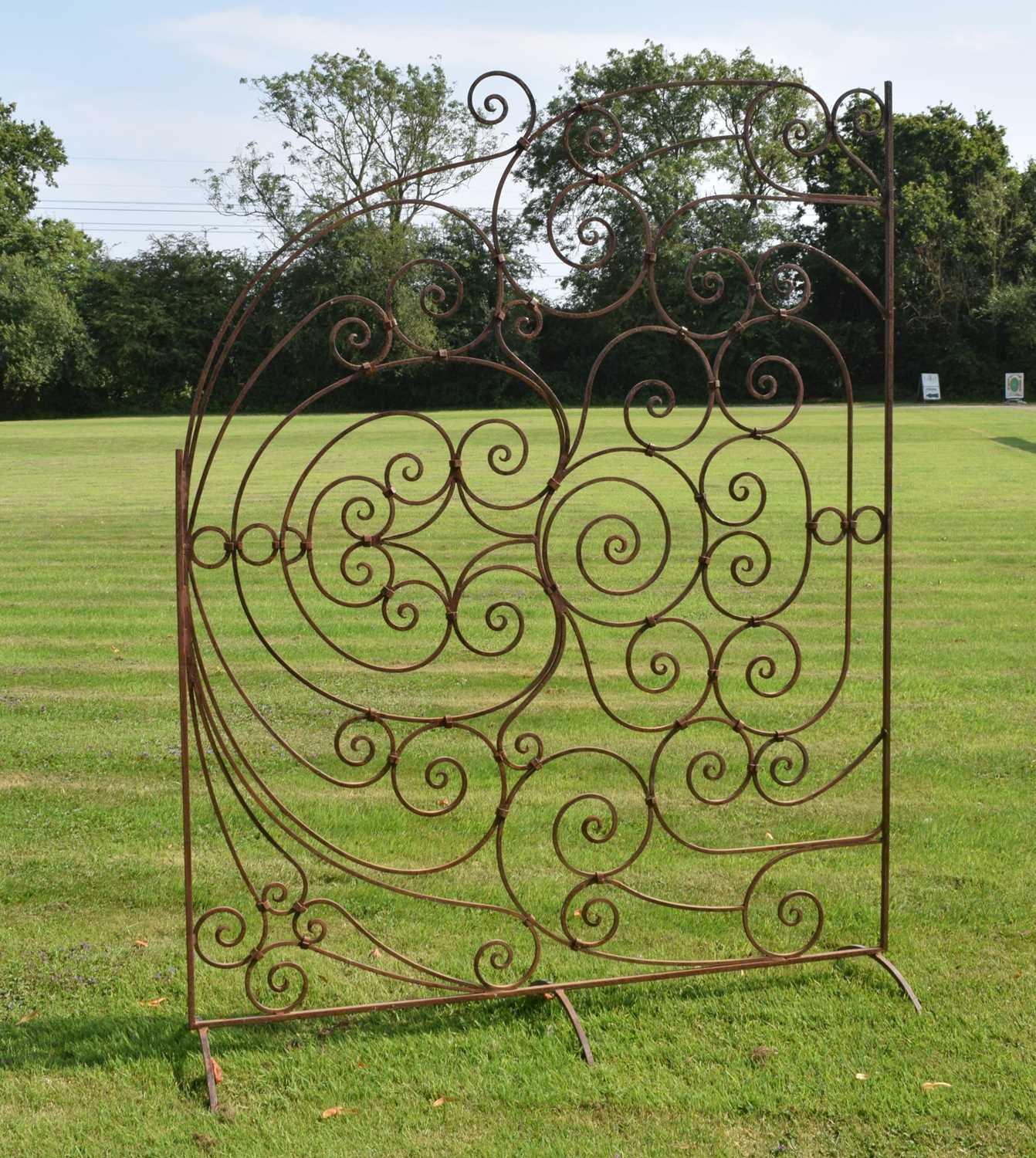 Lot 21 - Large wrought iron scrollwork screen or