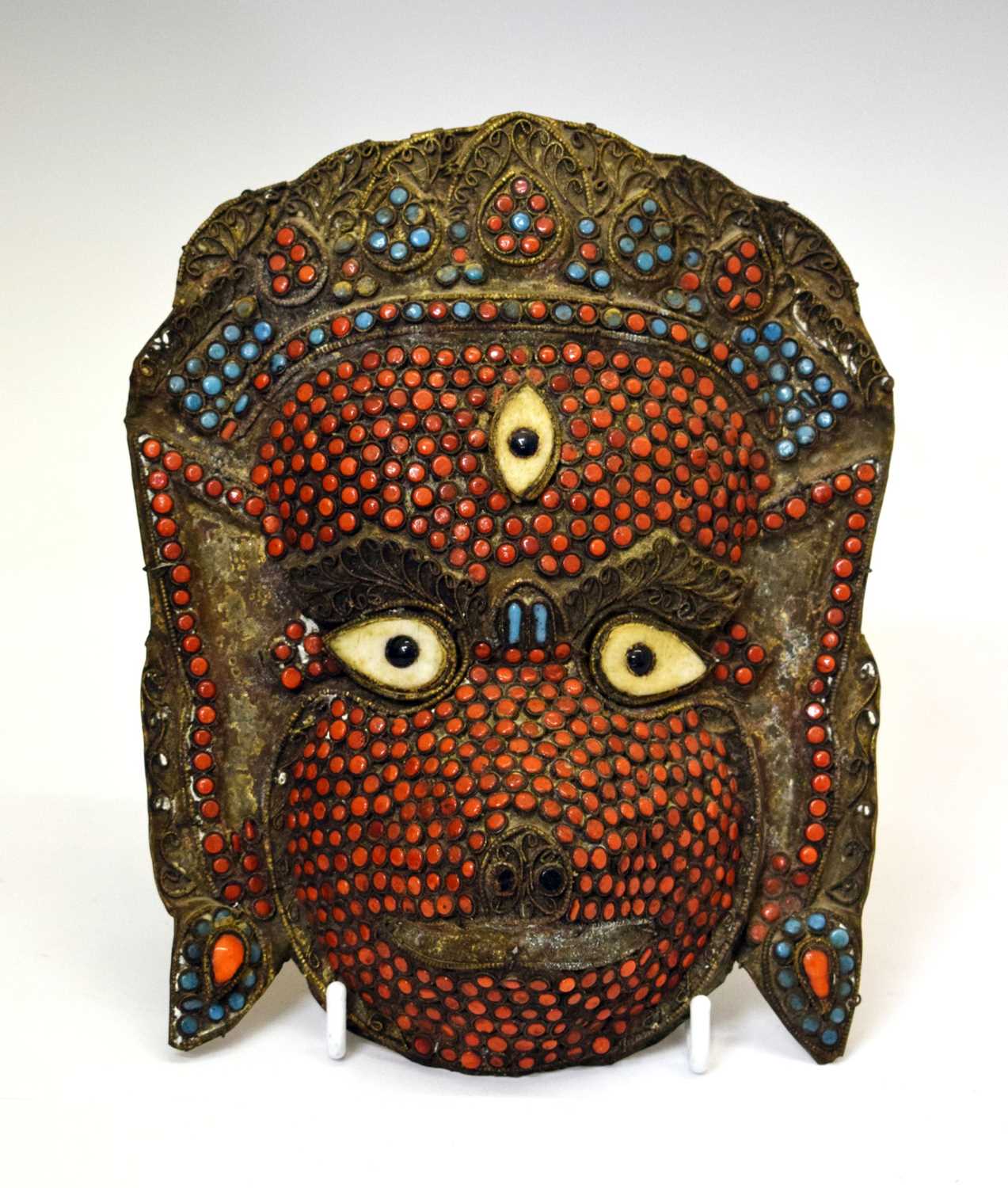 Lot 263 - South East Asian sheet brass mask, circa