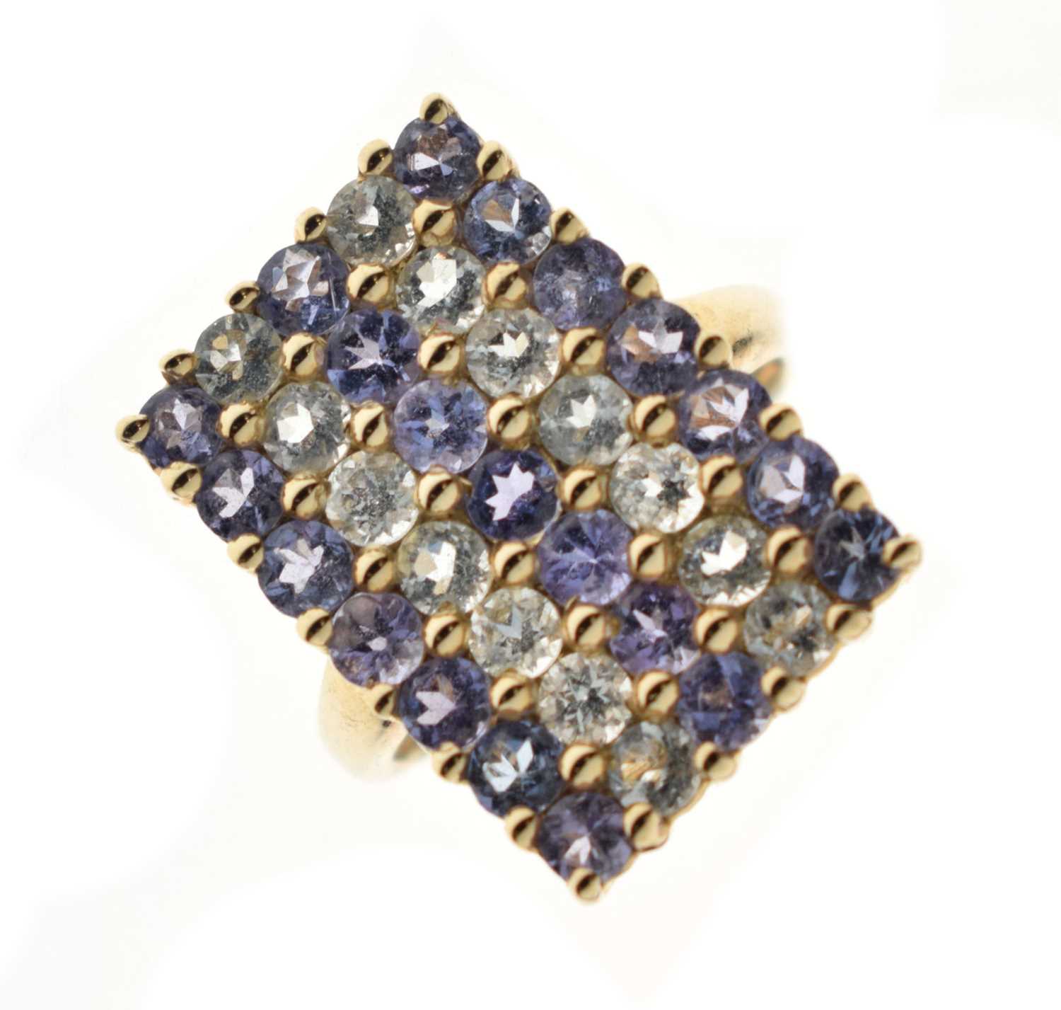 Lot 36 - Tanzanite and white stone five-row 9ct gold