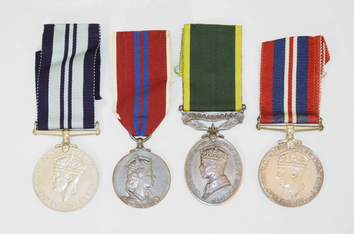 Lot 378 - Three George VI British medals, and