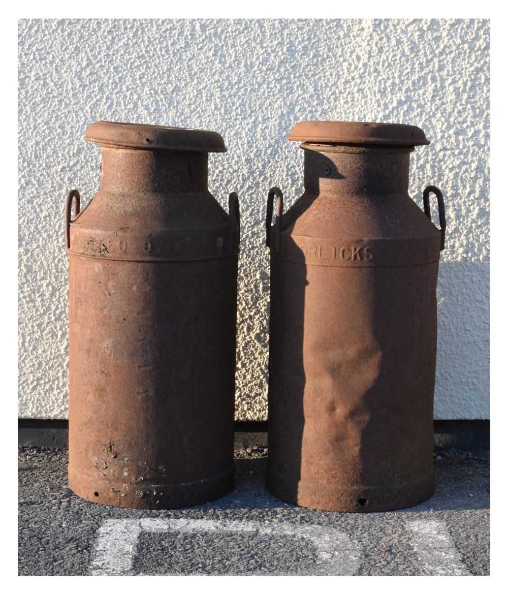 Lot 817 - Two vintage milk churns